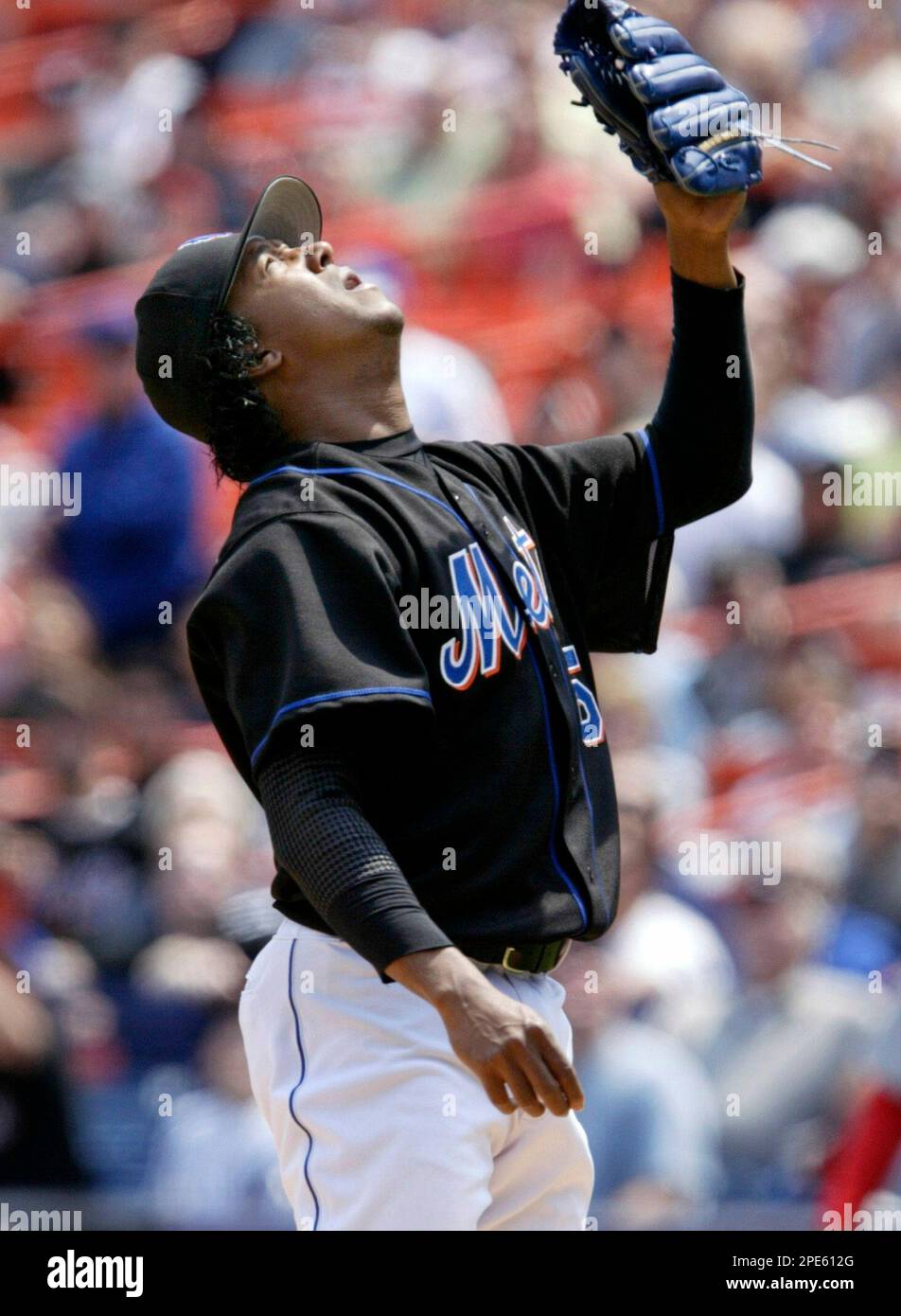 New York Mets pitcher Pedro Martinez of the Dominican Republic looks up ...