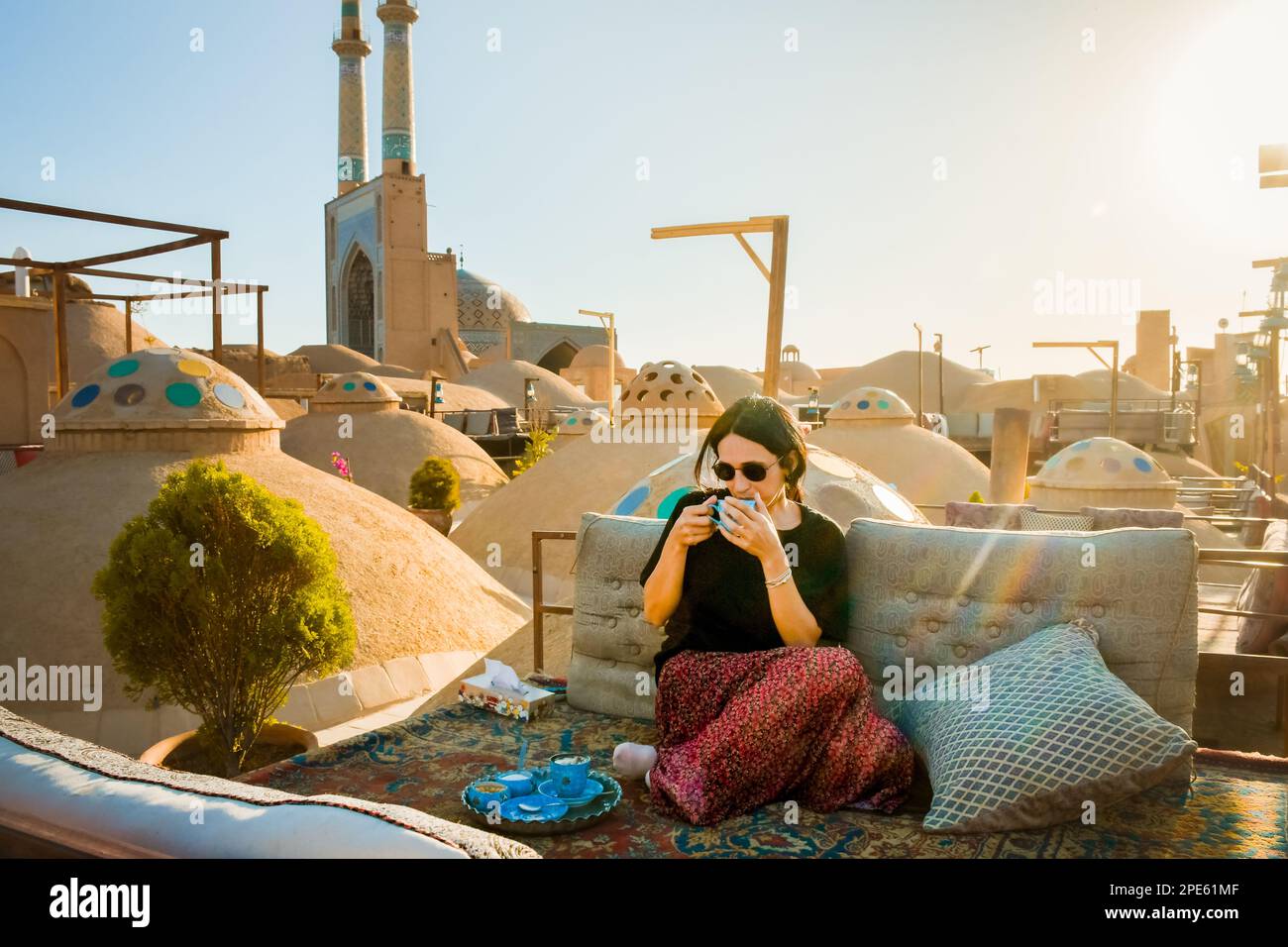 Yazd, Iran - 19th june, 2022: female caucasian tourist drink persian ...
