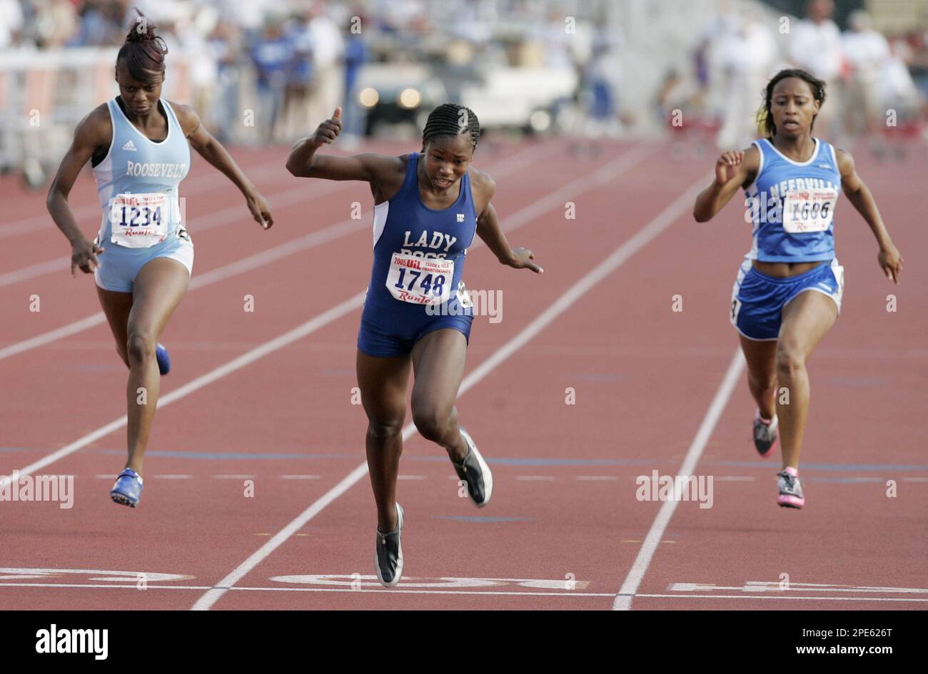 Sweeny's Dorrie Thompson (1748) crosses the finish line to win the ...