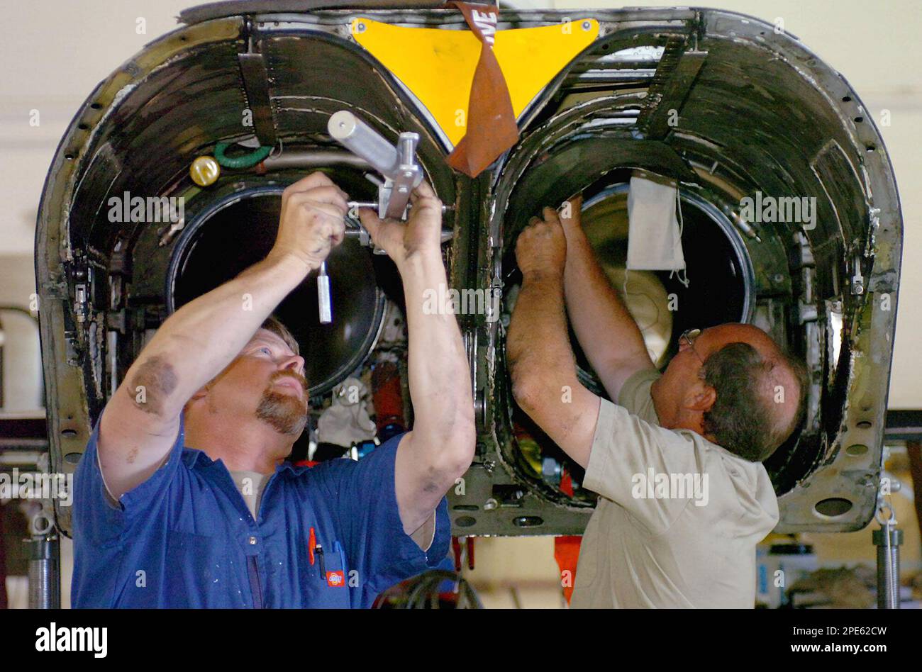 Dyncorp aircraft mechanics Robert Carter, left, and Ron Wenck, right ...