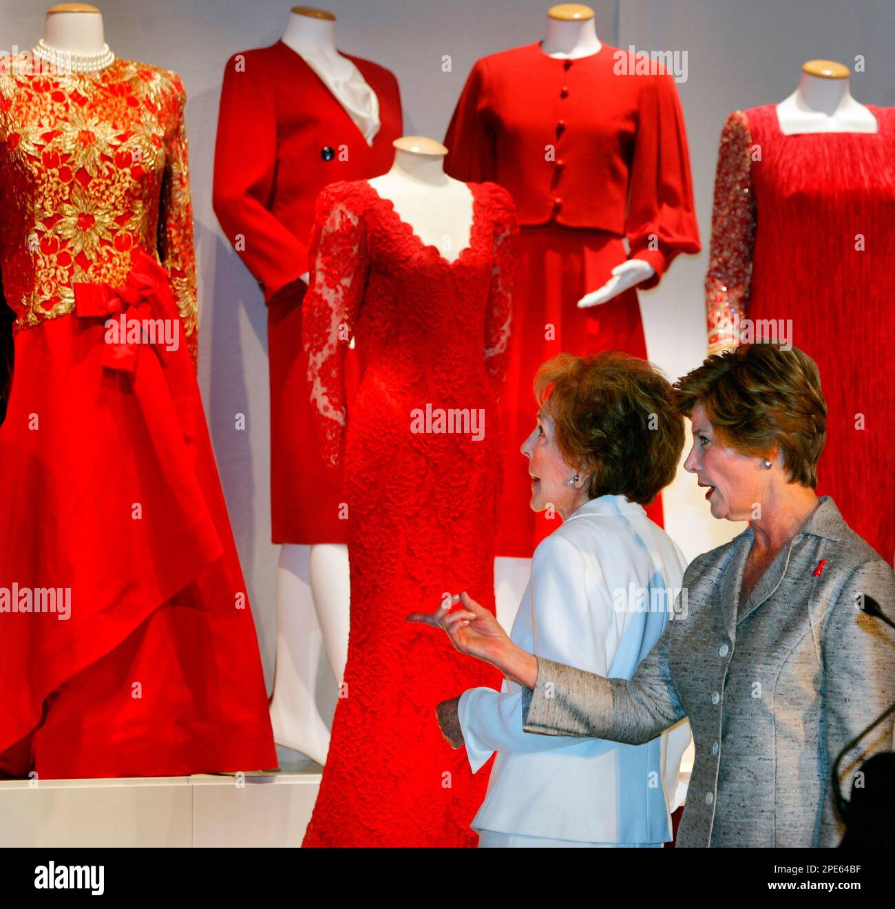 Nancy Reagan, left, famous for her love of red dresses, and First Lady ...