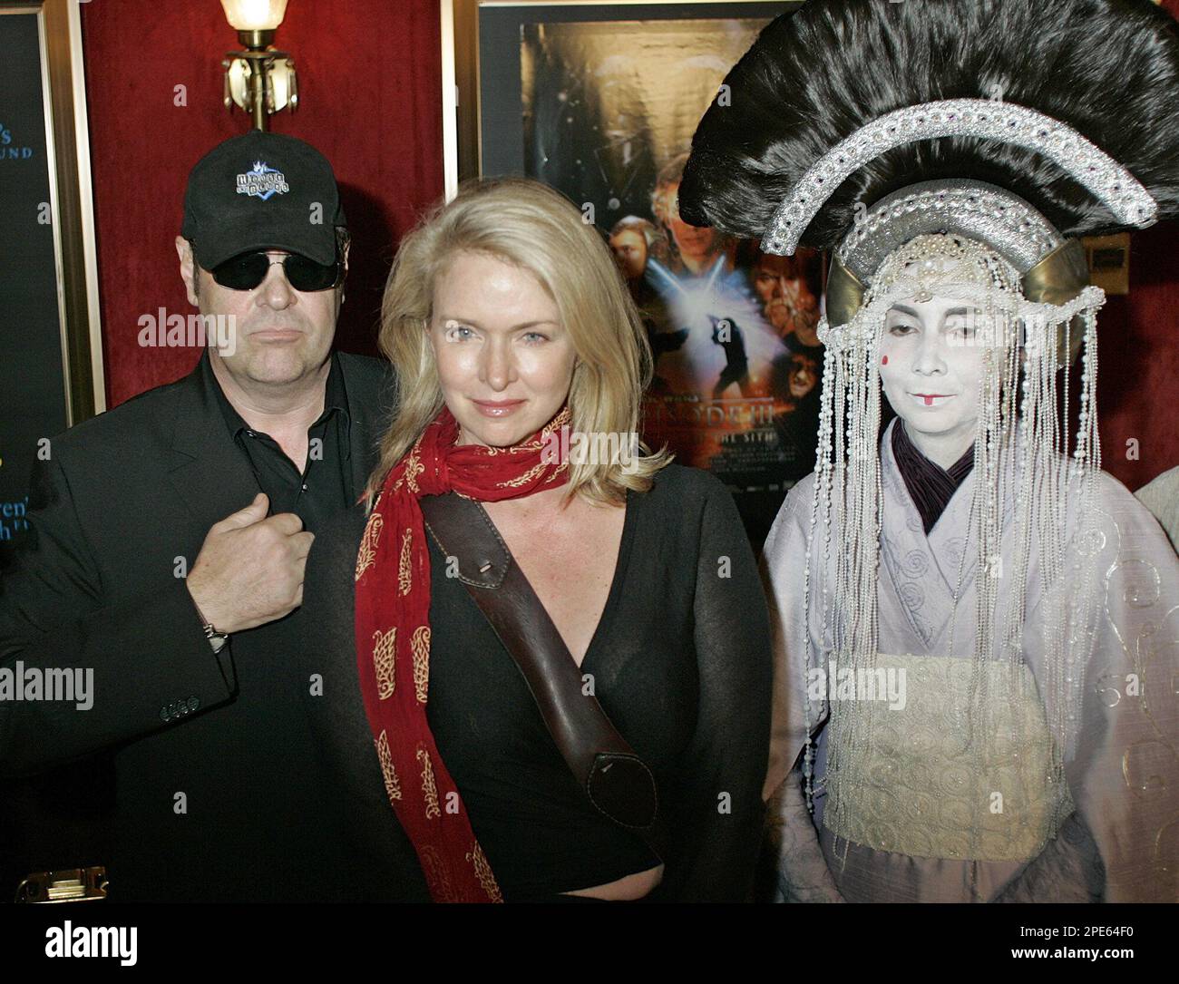 Dan Aykroyd and his wife Donna Dixen pose next to Star Wars fan Mary ...