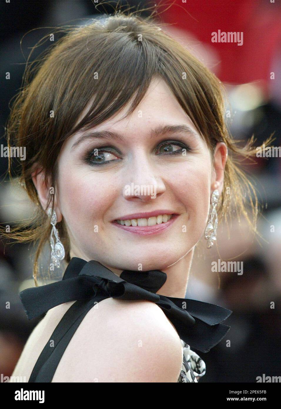 British actress Emily Mortimer looks at spectators as she arrives for ...