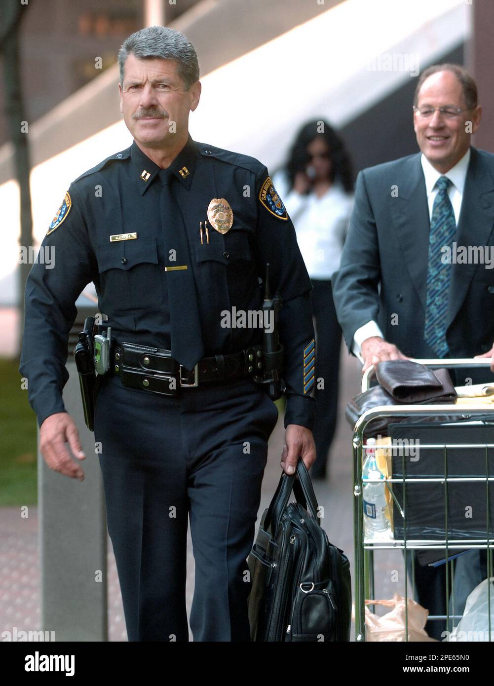 San Diego Police Capt. Chris Ball, left, and defense attorney Michael ...