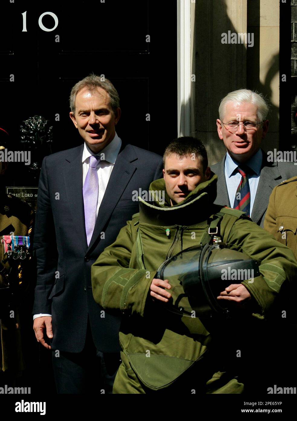Britain's Prime Minister Tony Blair, left, stands with an unidentified ...
