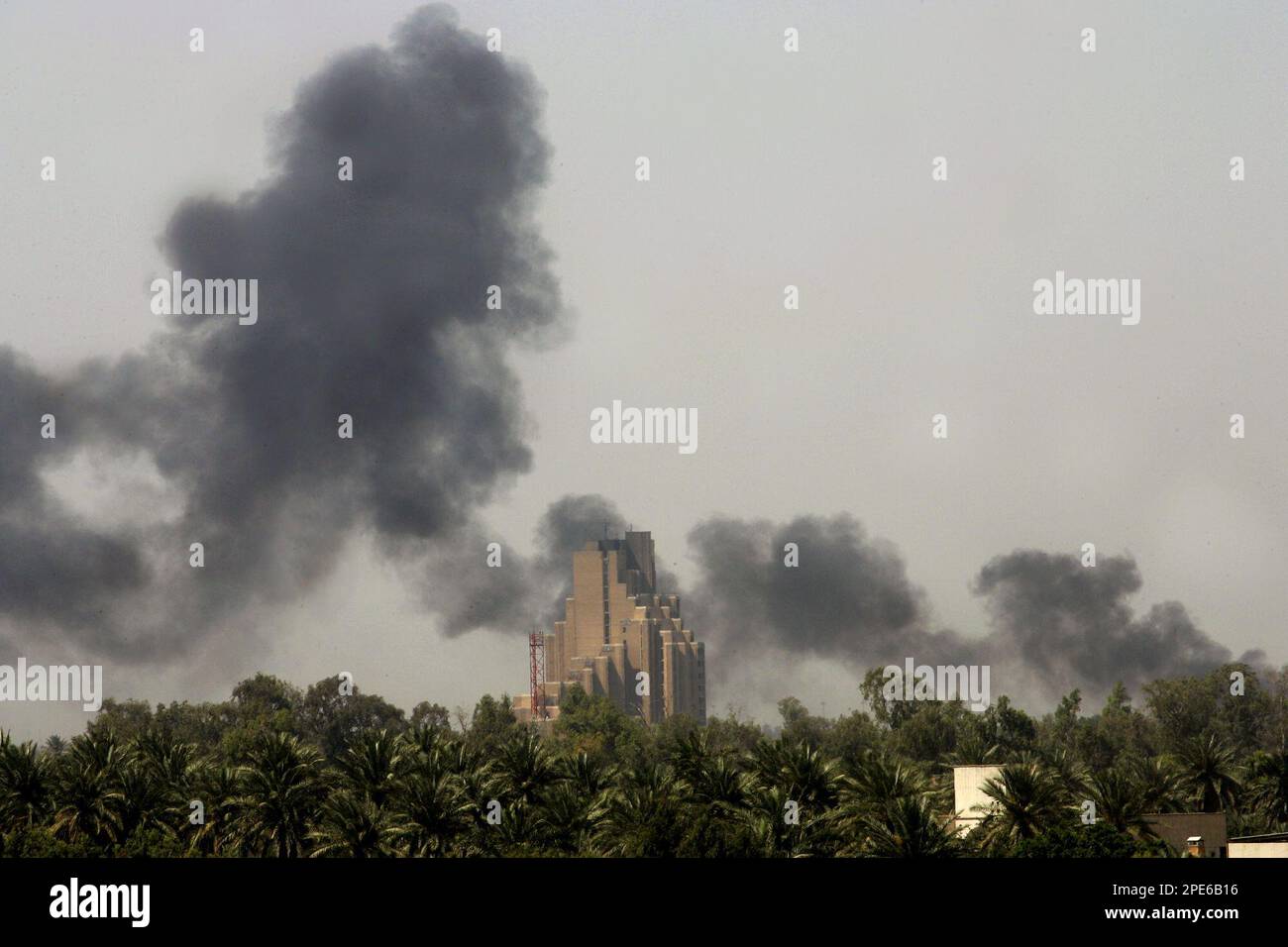 Smoke bellows over the center of Baghdad, Iraq, Tuesday, May 10, 2005 ...