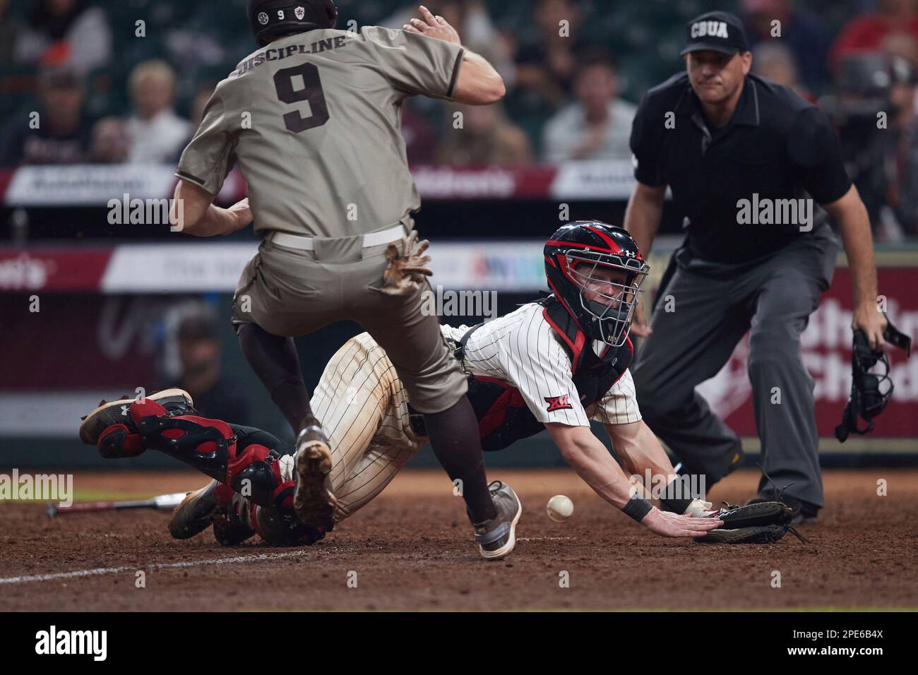 Texas Tech Red Raiders catcher Hudson White (5) can't handle the throw ...