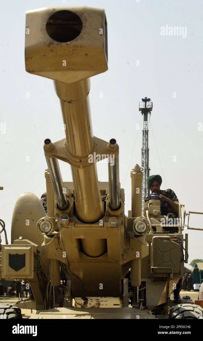 An Indian army soldier sits on a 155 mm Bofors howitzer during exercise ...