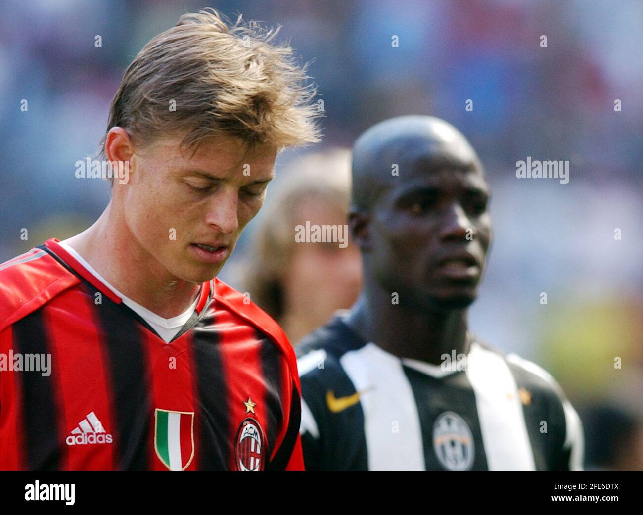AC Milan forward Jon Dahl Tomasson, of Denmark, leaves the field after ...