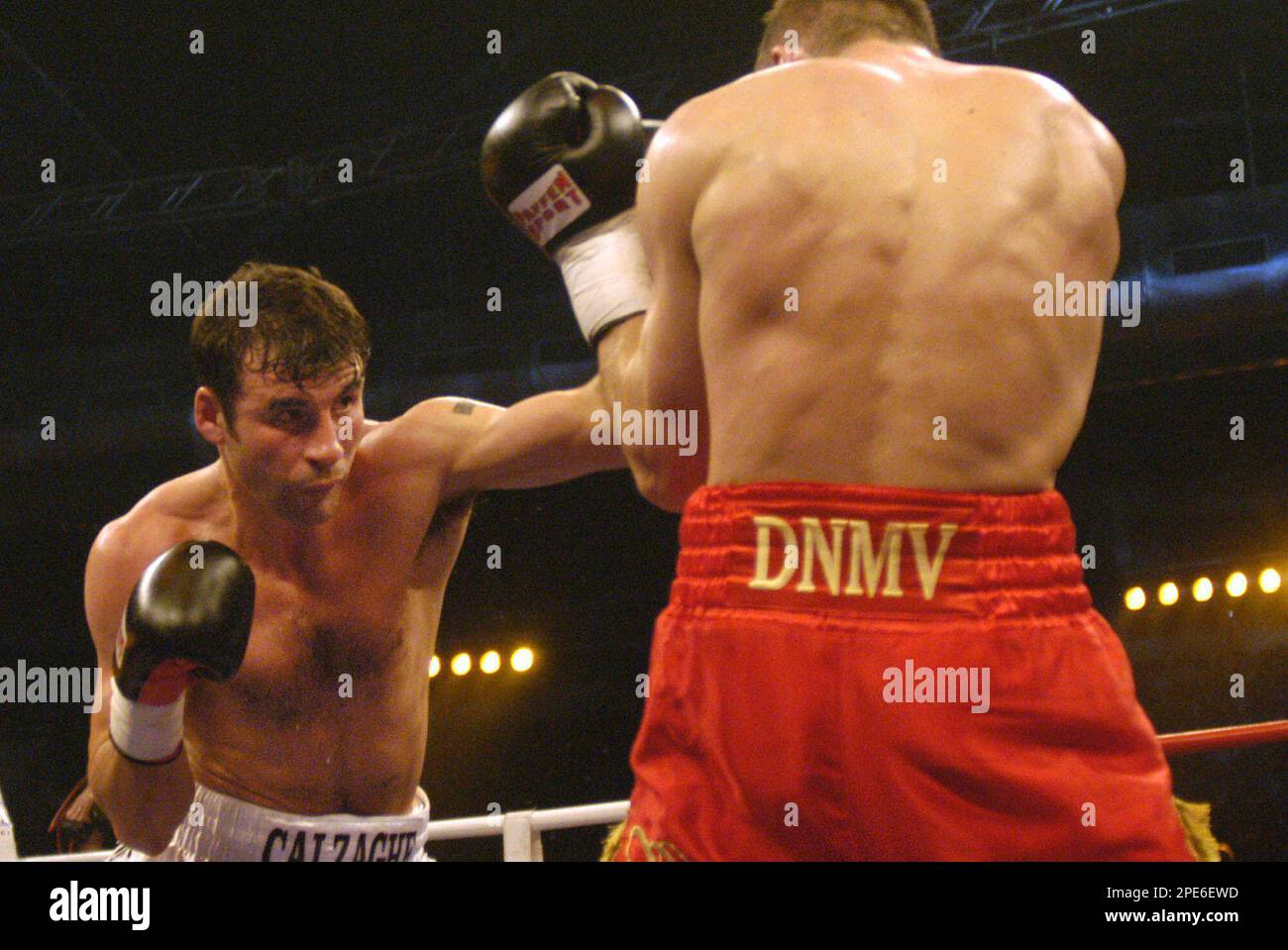 British boxer Joe Calzaghe, left, hits his opponent German boxer Mario ...