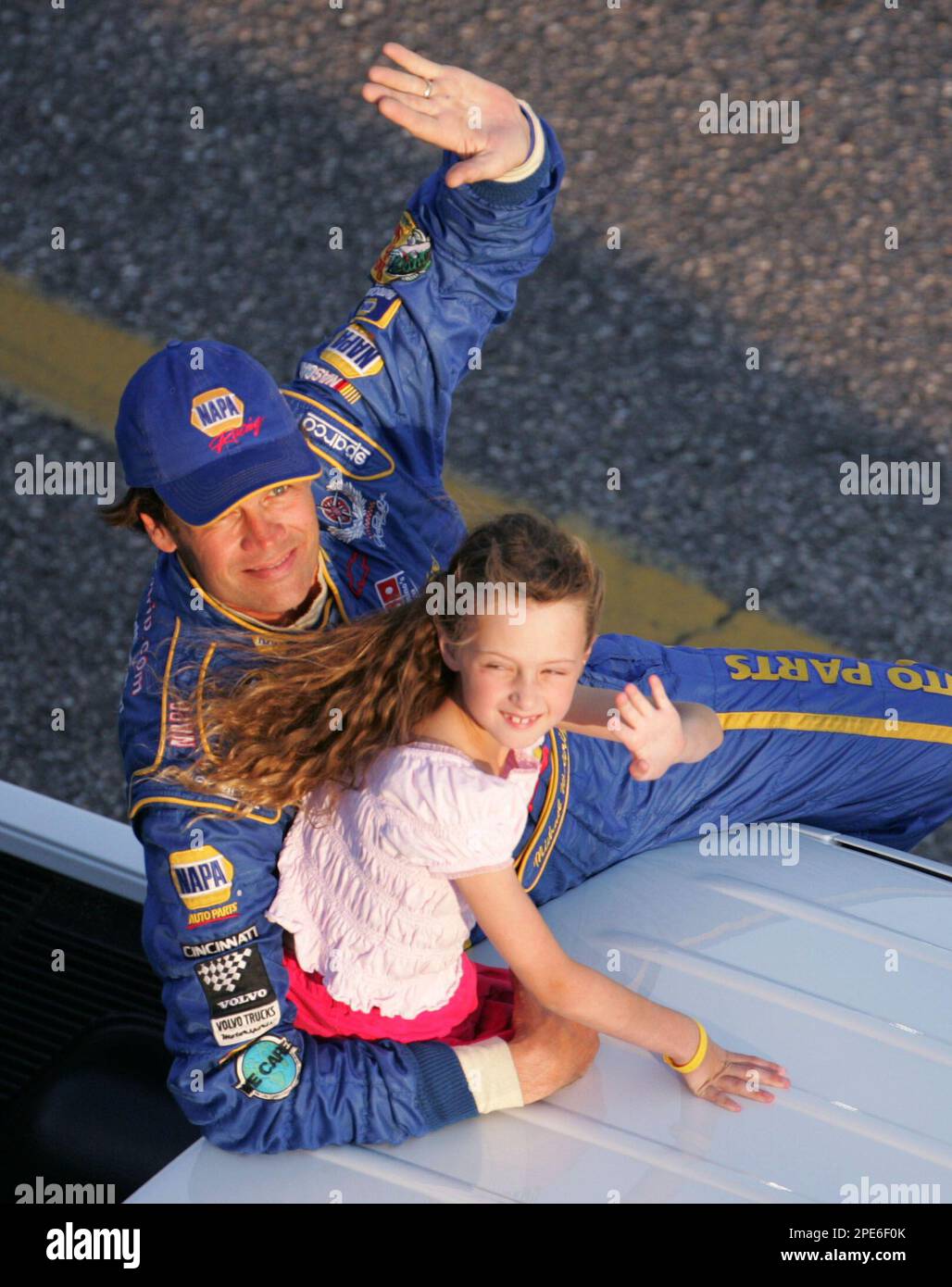 Michael Waltrip and his daughter Margaret wave to fans as they ...