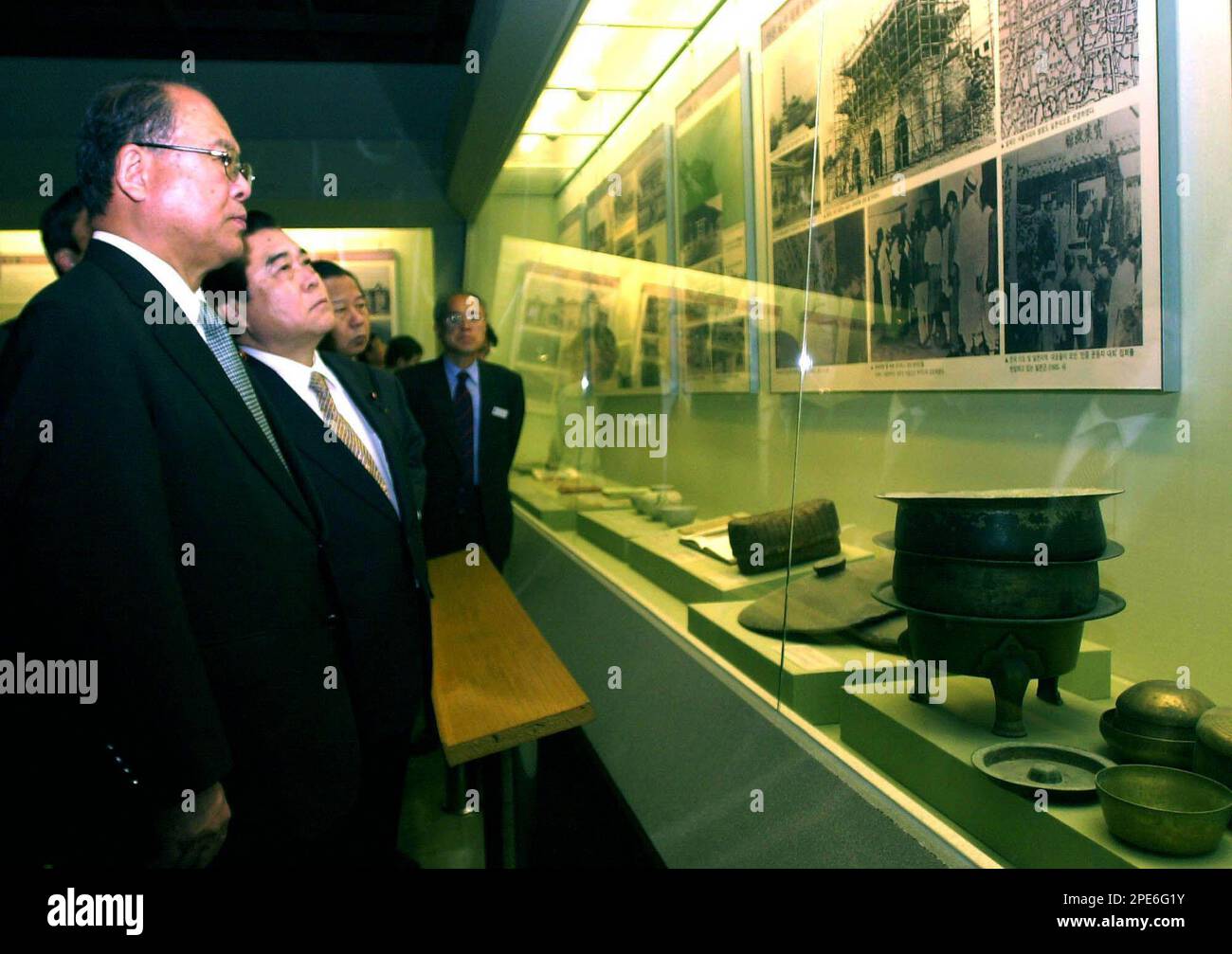 Japan's Liberal Democratic Party Secretary General Tsutomu Takebe, left ...