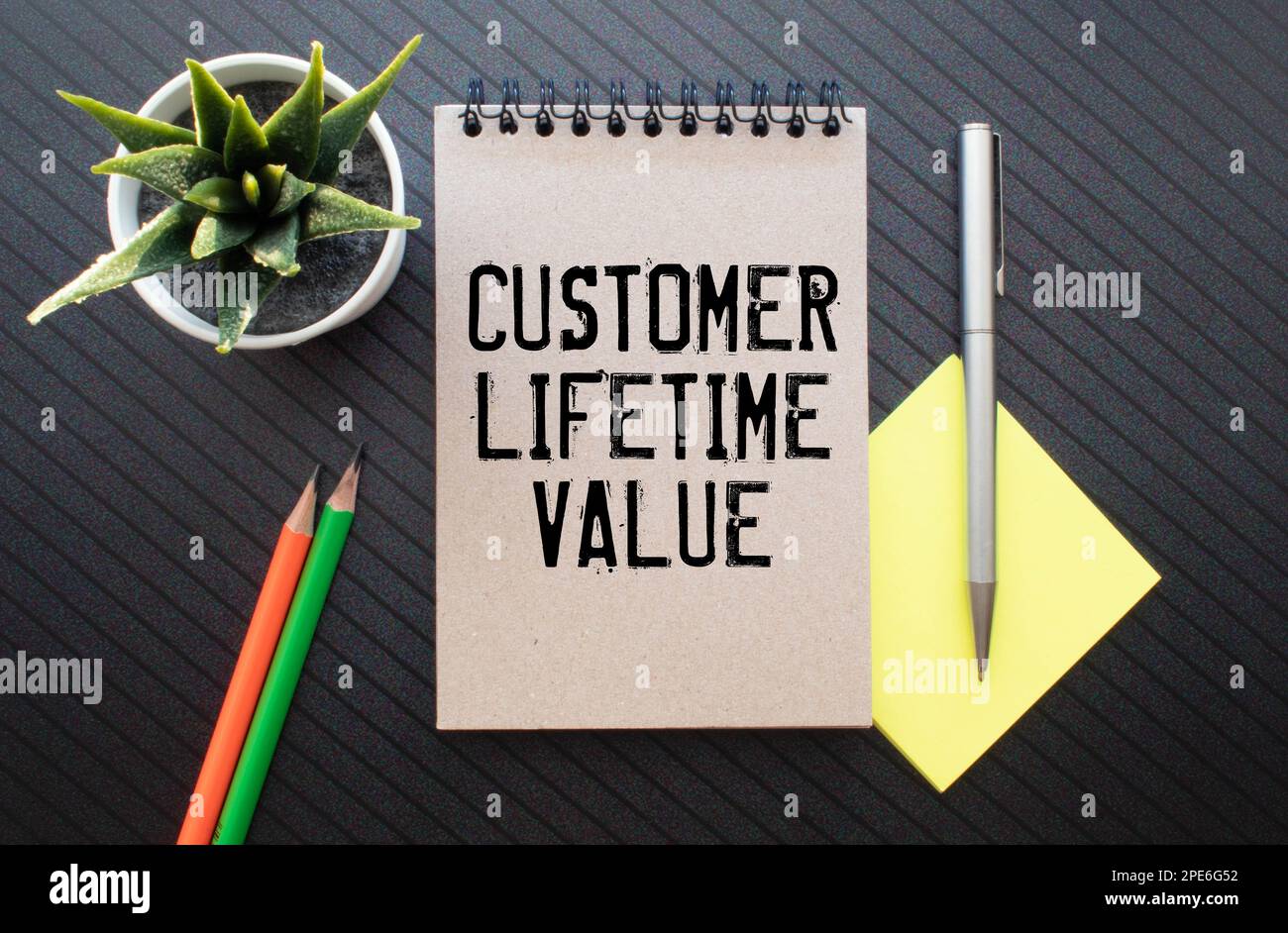 Customer Lifetime Value - handwritten text in a notebook on a desk - 3d ...