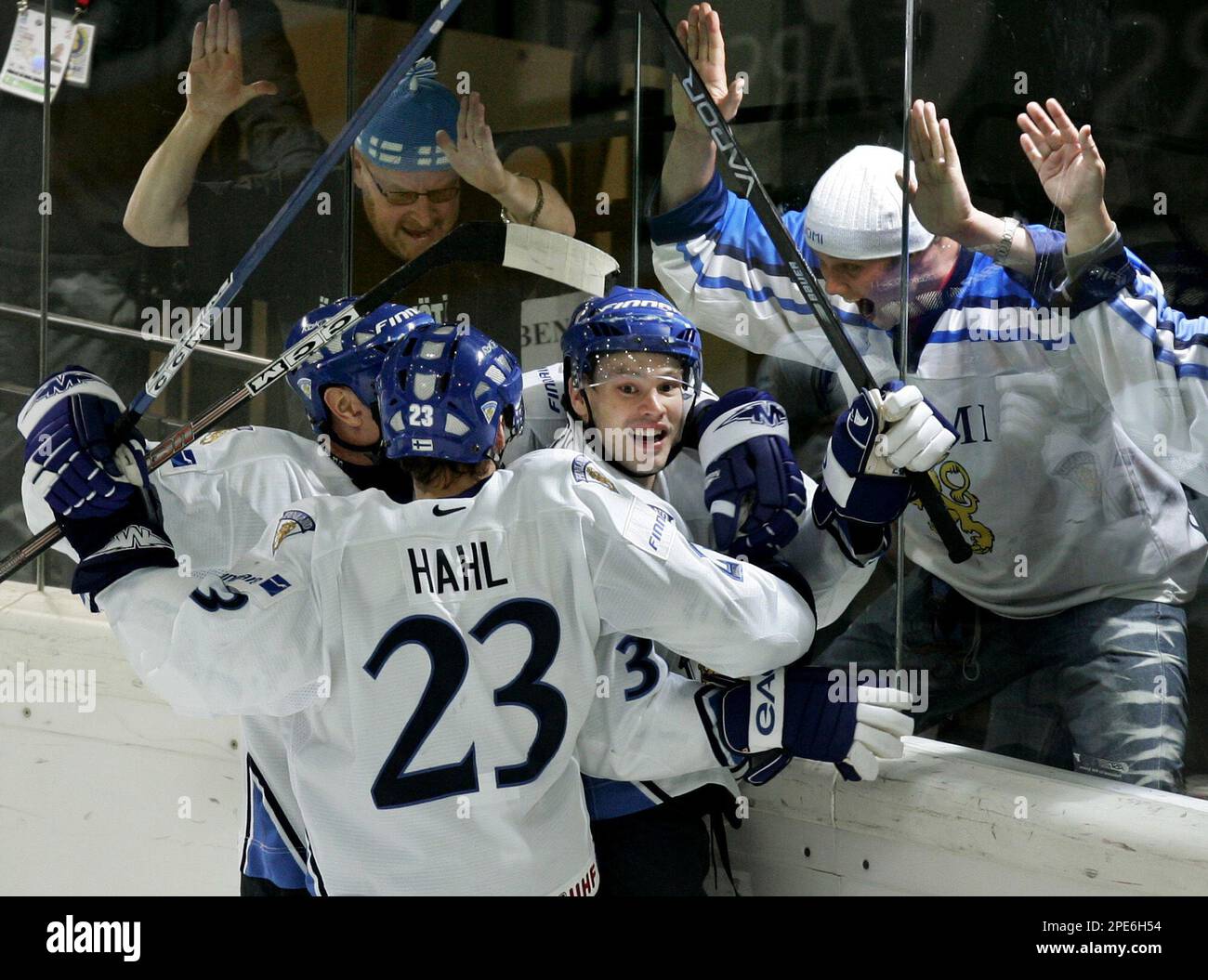 Finland's Jarkko Ruutu, right, celebrates with teammates Jere Karlahati ...