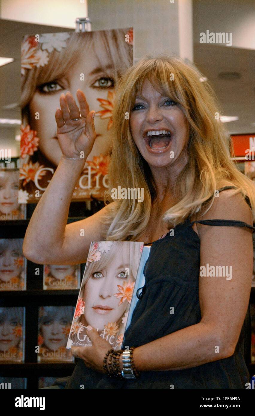 Actress Goldie Hawn waves during a book signing in Boston Friday, May 6 ...