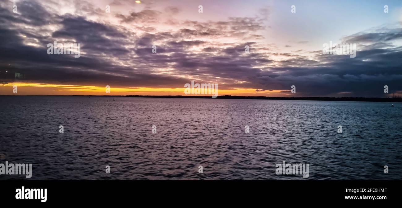 A breathtaking view of a majestic sunset over the sea, Isle of Wight ...