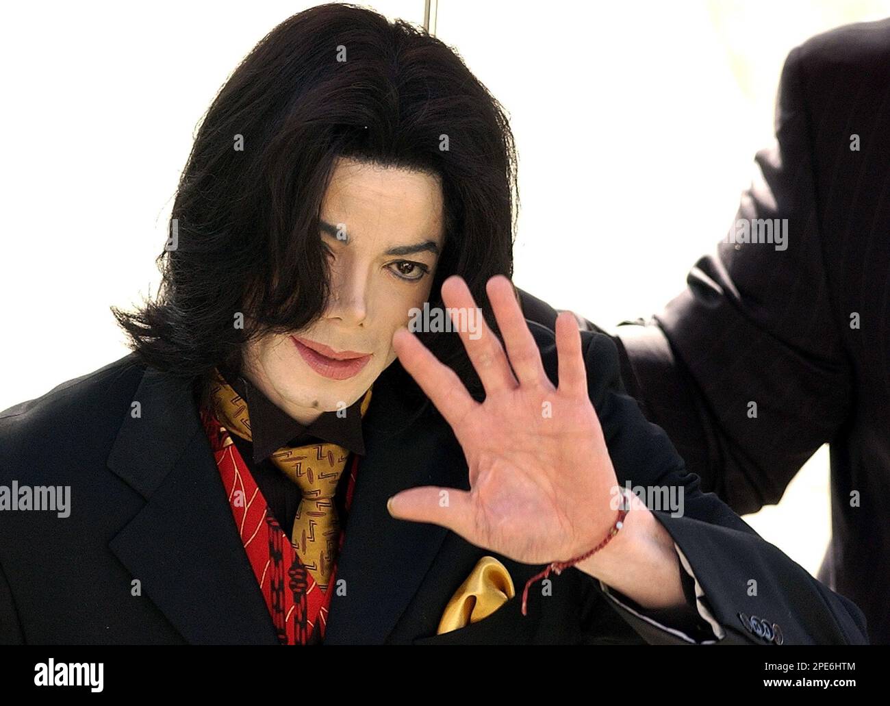 Michael Jackson waves as he arrives for court at the Santa Barbara ...