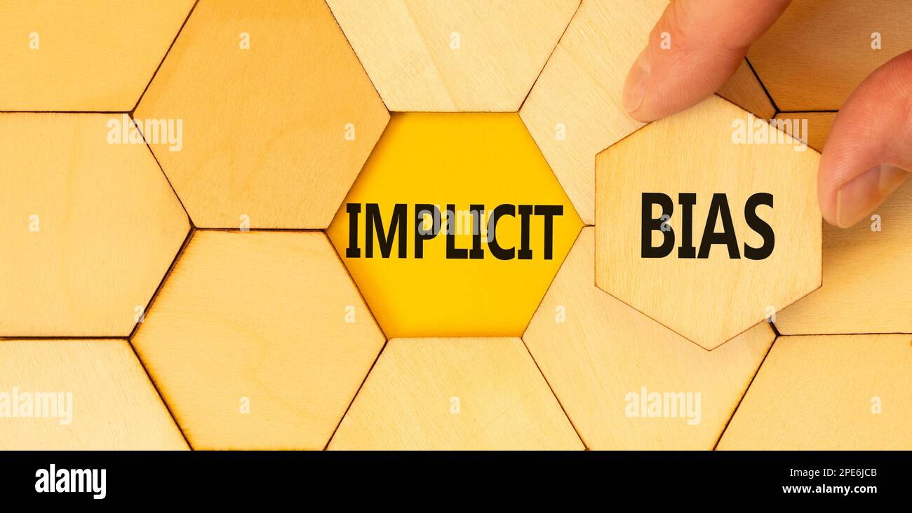 Implicit bias symbol. Concept words Implicit bias on wooden puzzles ...