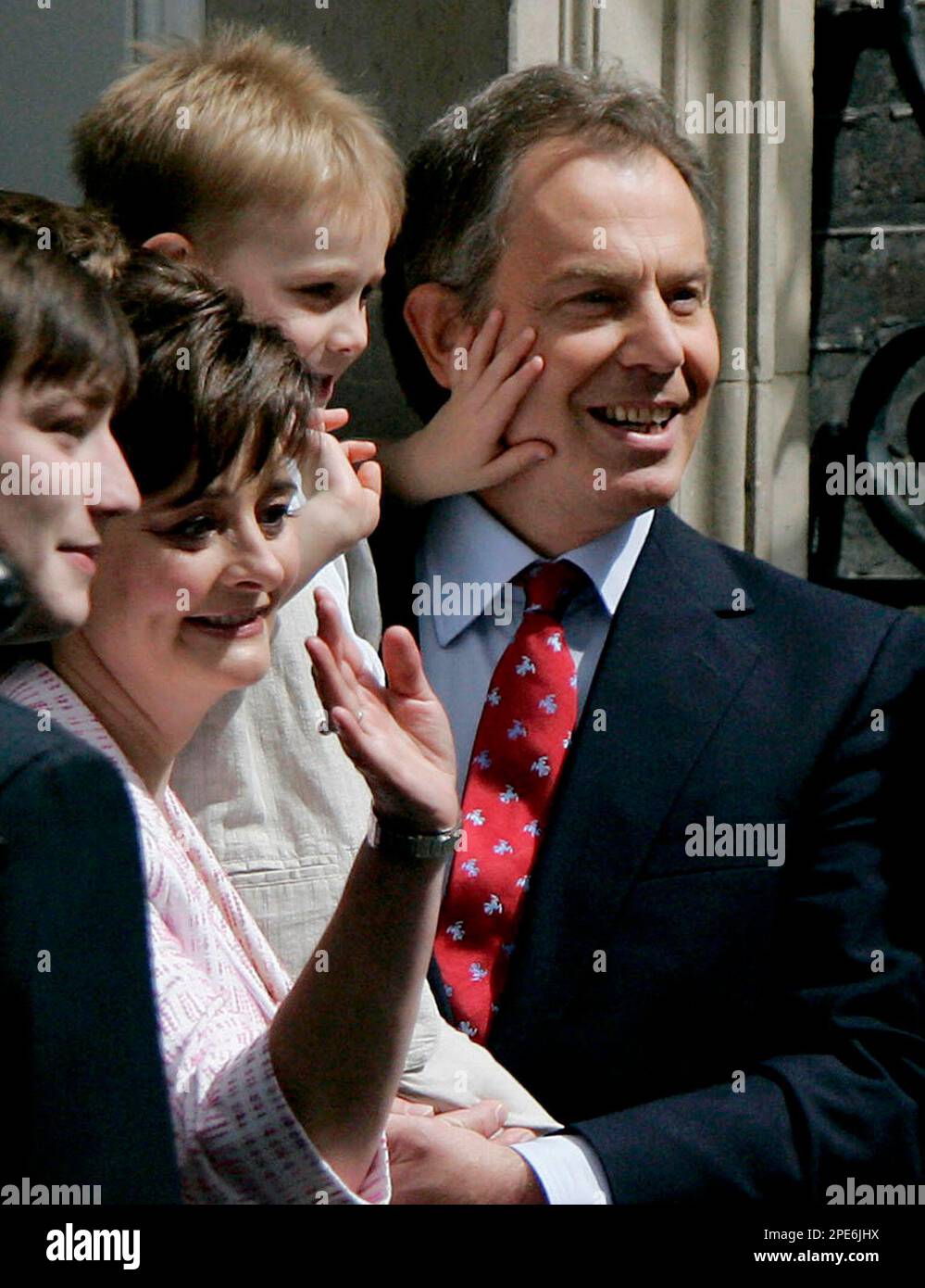 British Prime Minister Tony Blair, right, holds his youngest son Leo ...