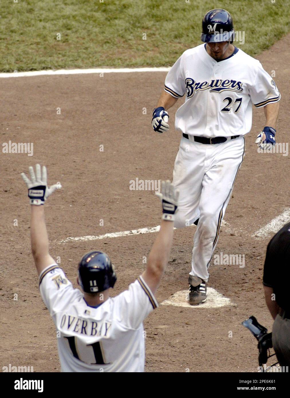 Milwaukee Brewers' Brady Clark, right, scores the game winning run ...
