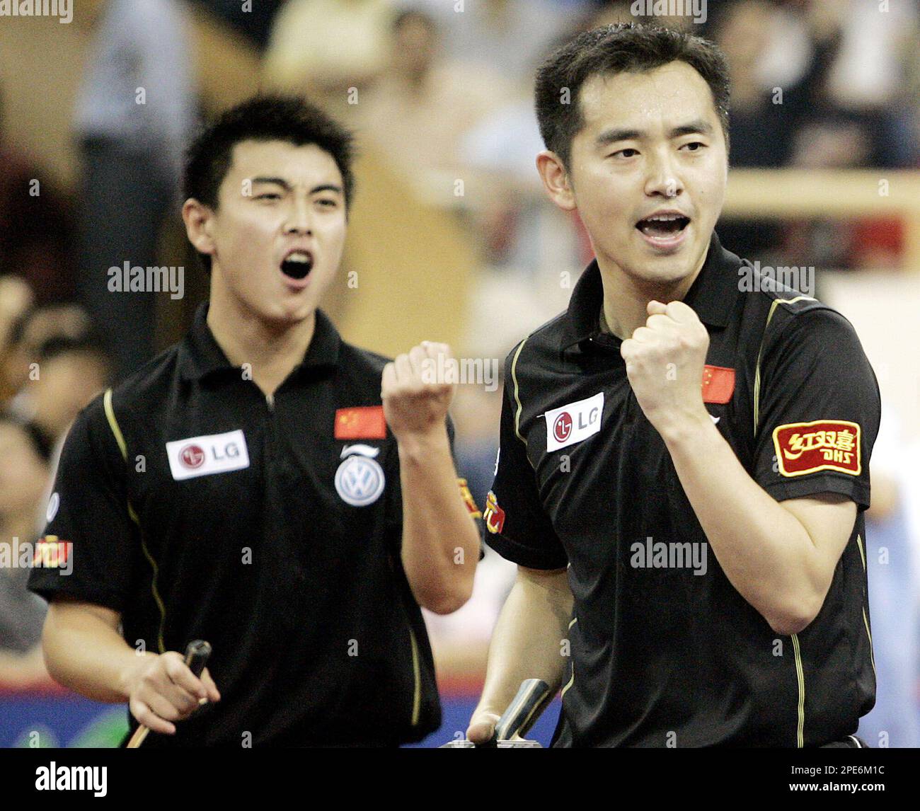 Kong Linghui, right, and Wang Hao, left, of China celebrate after ...