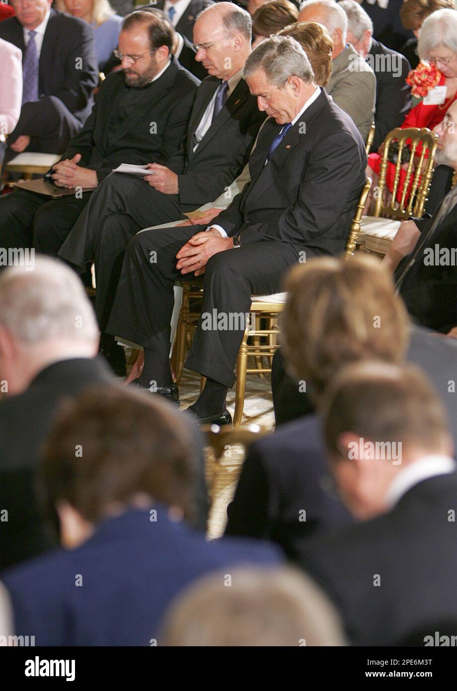 President Bush prays during the National Day of Prayer event, Thursday ...