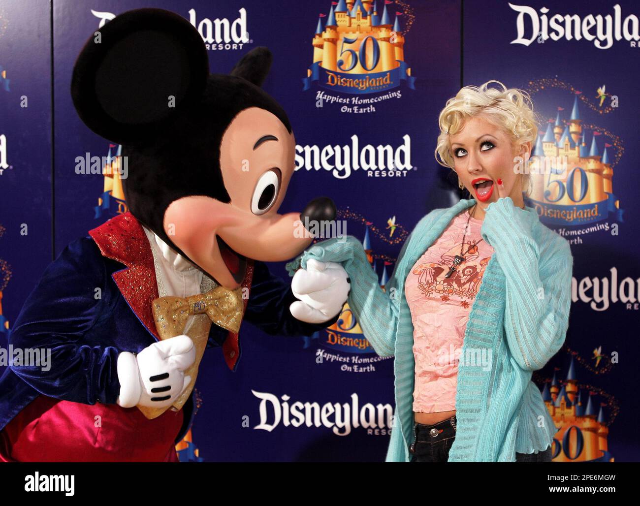 Singer Christina Aguilera reacts as Disney character Mickey Mouse ...