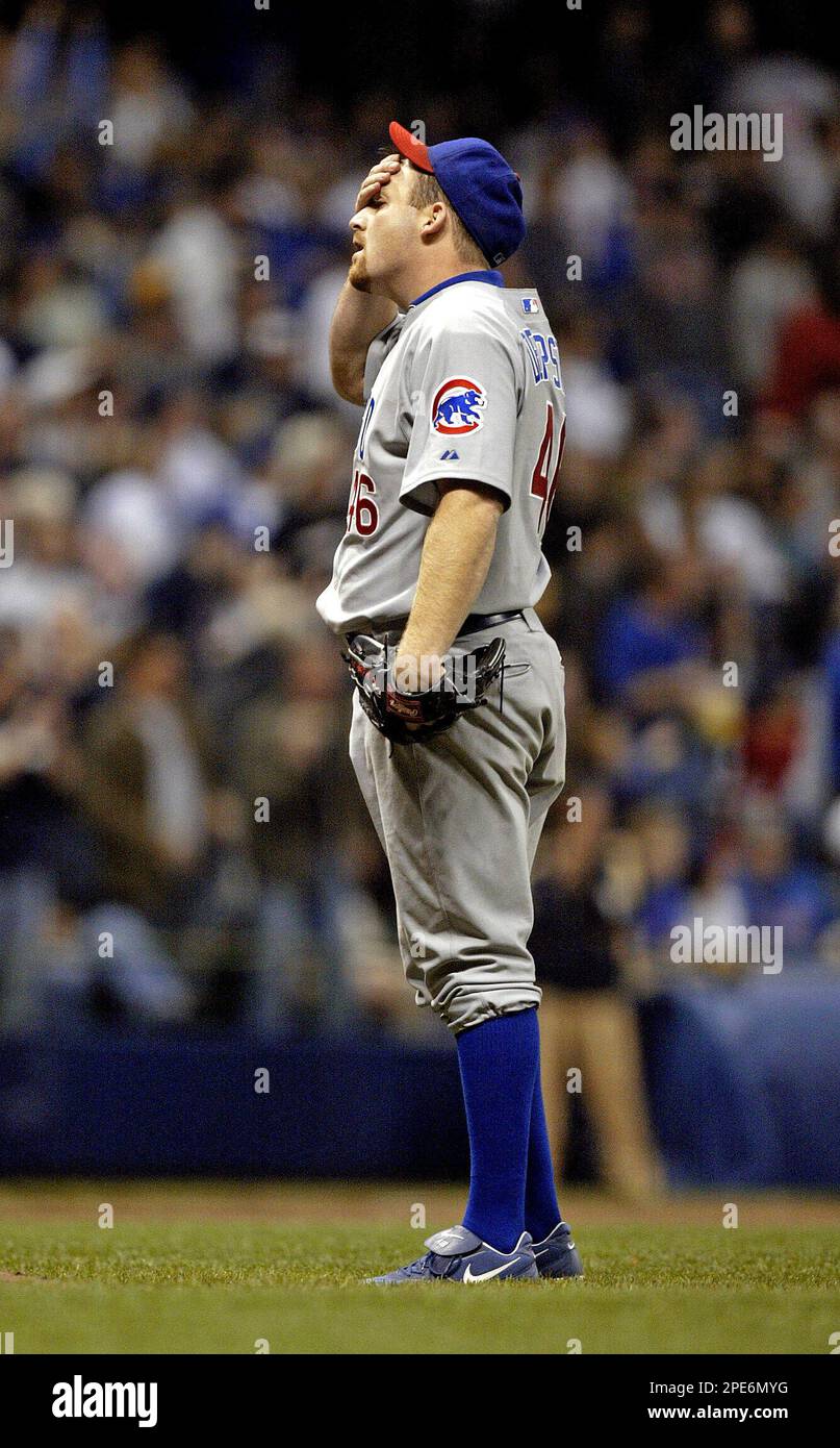 Chicago Cubs starter Ryan Dempster reacts after giving up a home run to ...