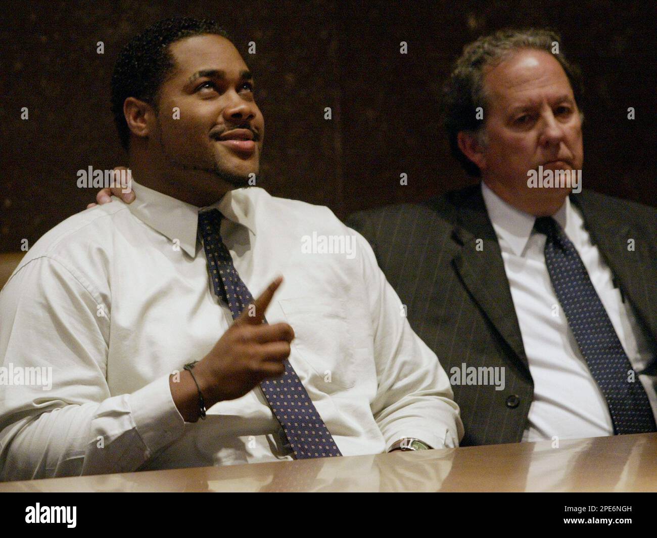 Former Nebraska football player Darren DeLone, left, and defense ...