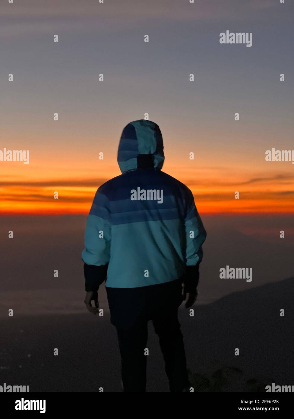 The Man greets the sunrise in the mountains. A man greet the dawn. West ...