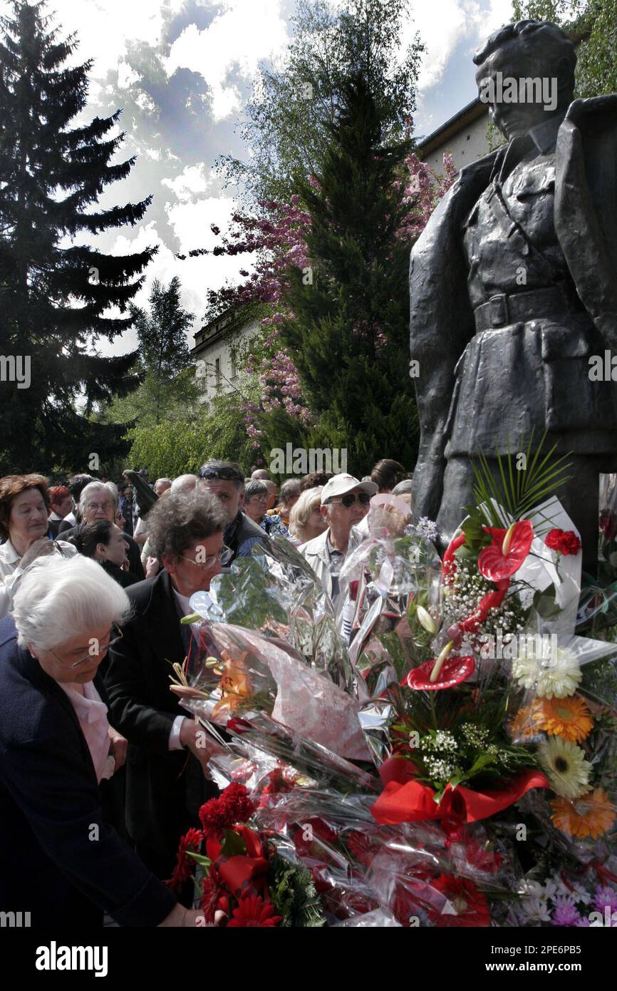 Survivors of the World War II, lay flowers in front of a statue of Tito ...