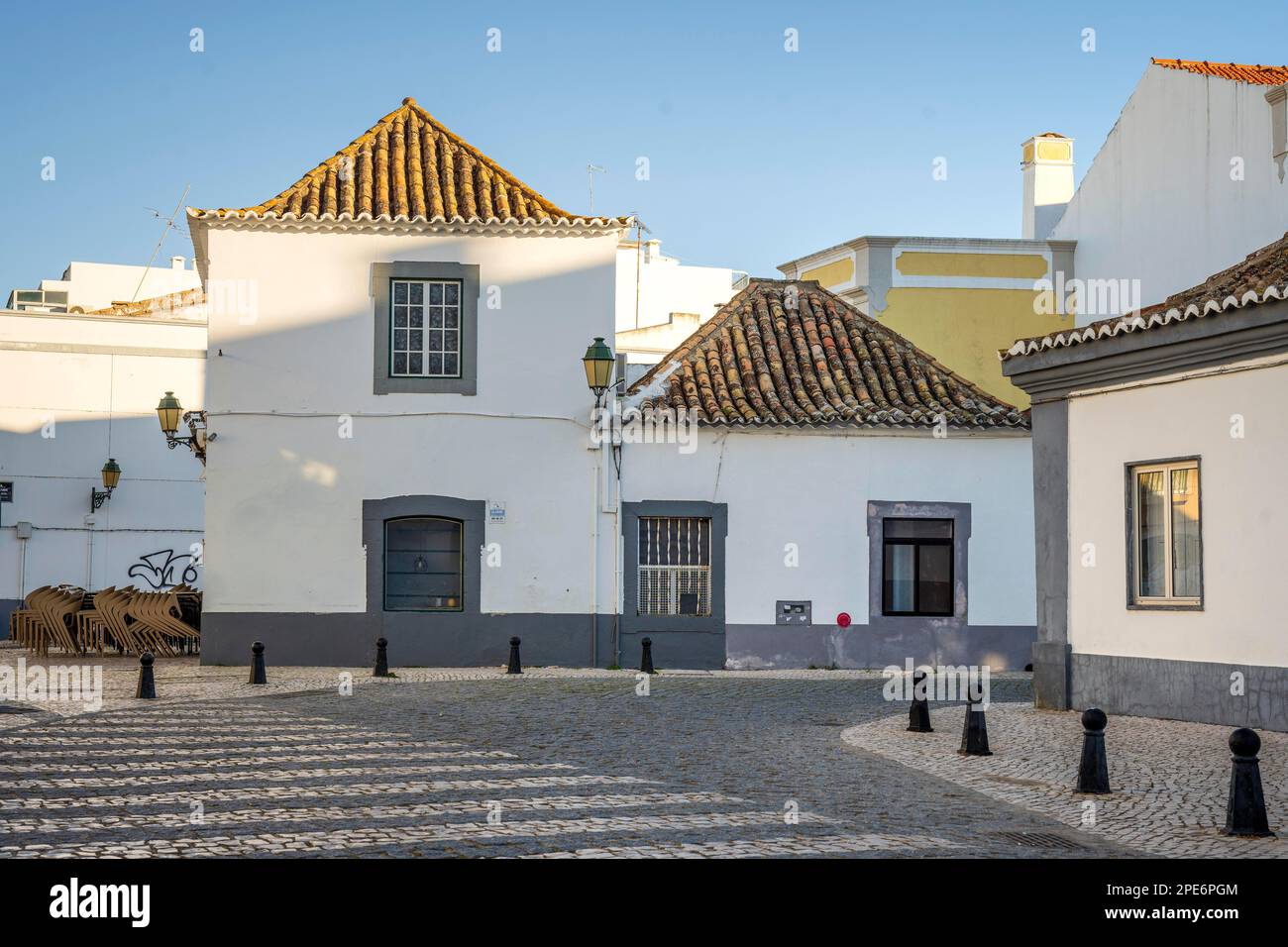Historic street in Faro with traditional Portuguese architecture ...