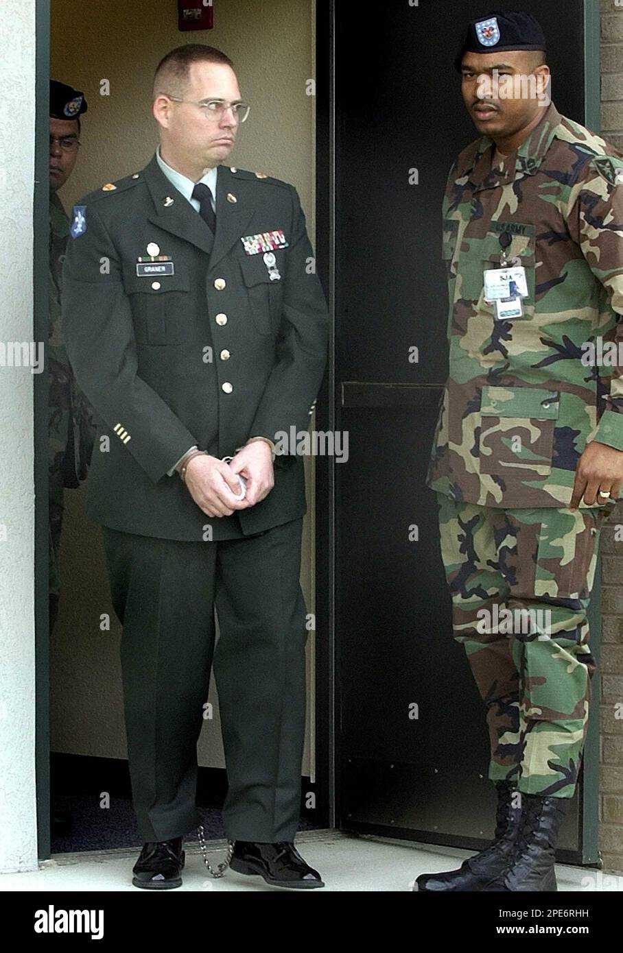 Army Pvt. Charles Graner is led out the back door of the judicial ...
