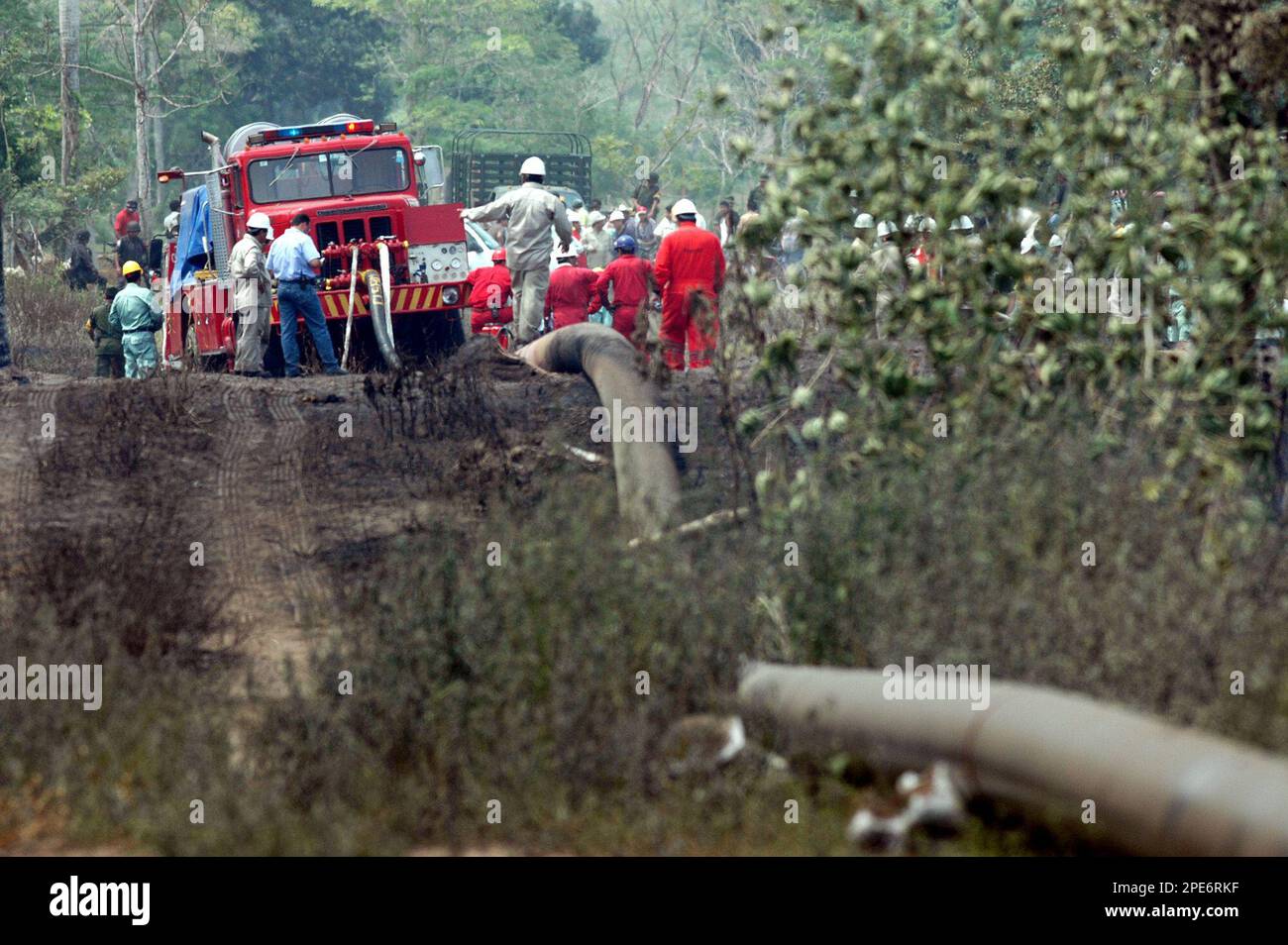 Emergency workers of the state-run oil monopoly Petroleos Mexicanos, or ...