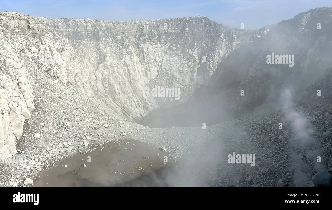 Seeing the inside of a volcano crater with smoke in east Java ...
