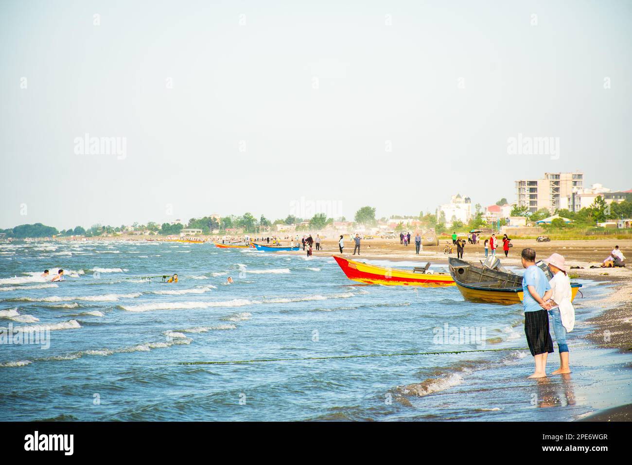 Traditional iranian colorful wooden motor boats on caspian sea shore in ...