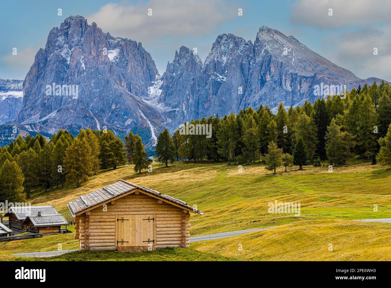 Alpine huts and autumnal alpine meadows on the Alpe di Siusi, in the ...