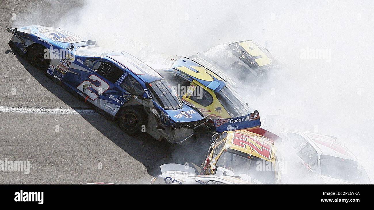 Cars spin through Turn 1 of the Talladega Superspeedway in Talladega ...