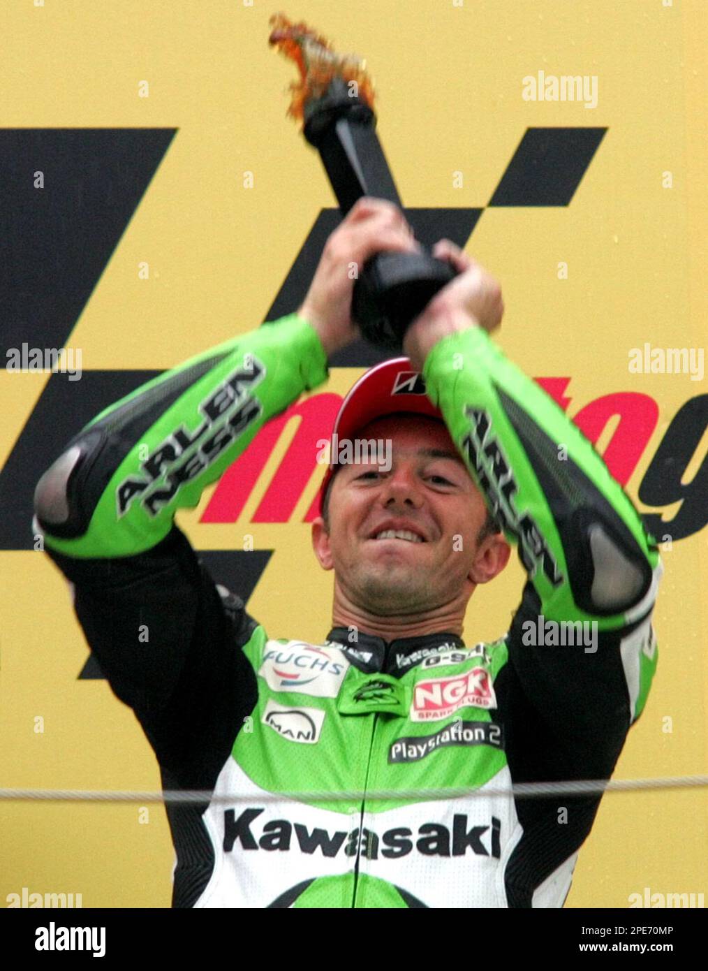 France's Olivier Jacque celebrates on the podium after taking second ...