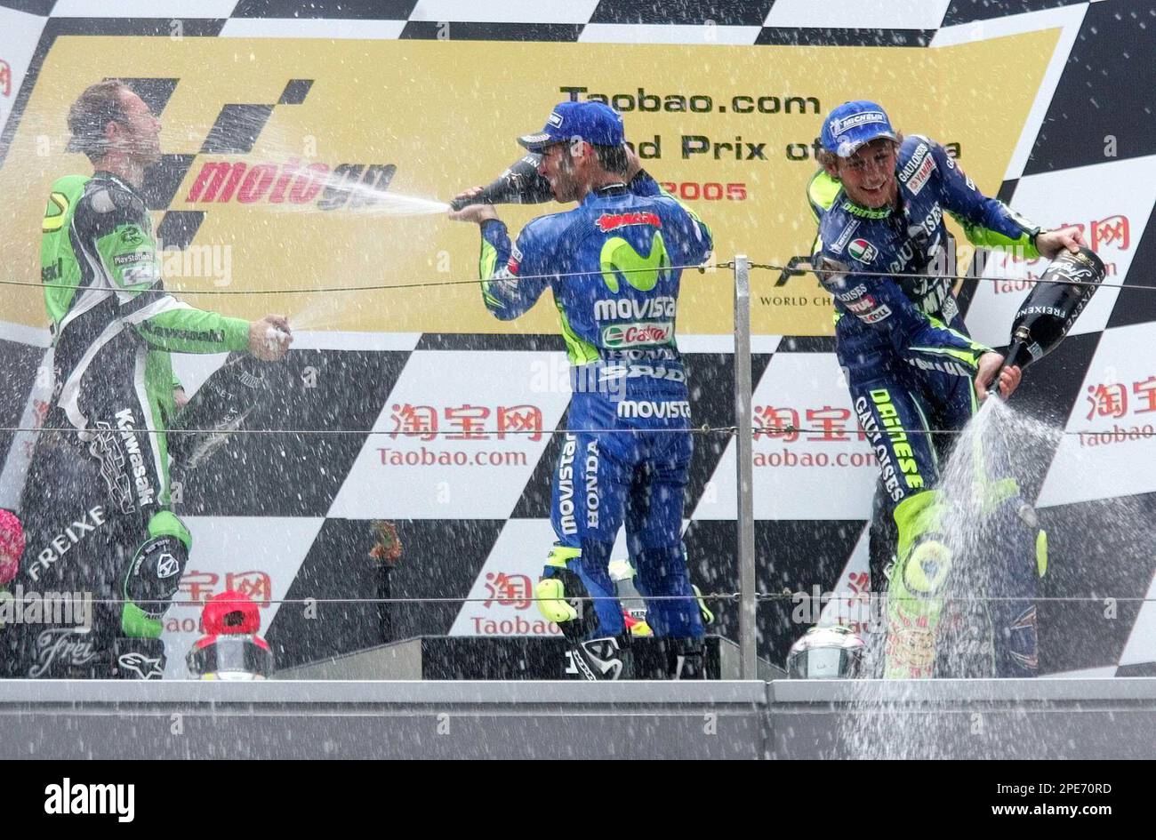 Italy's Valentino Rossi, right, celebrates with second place getter ...
