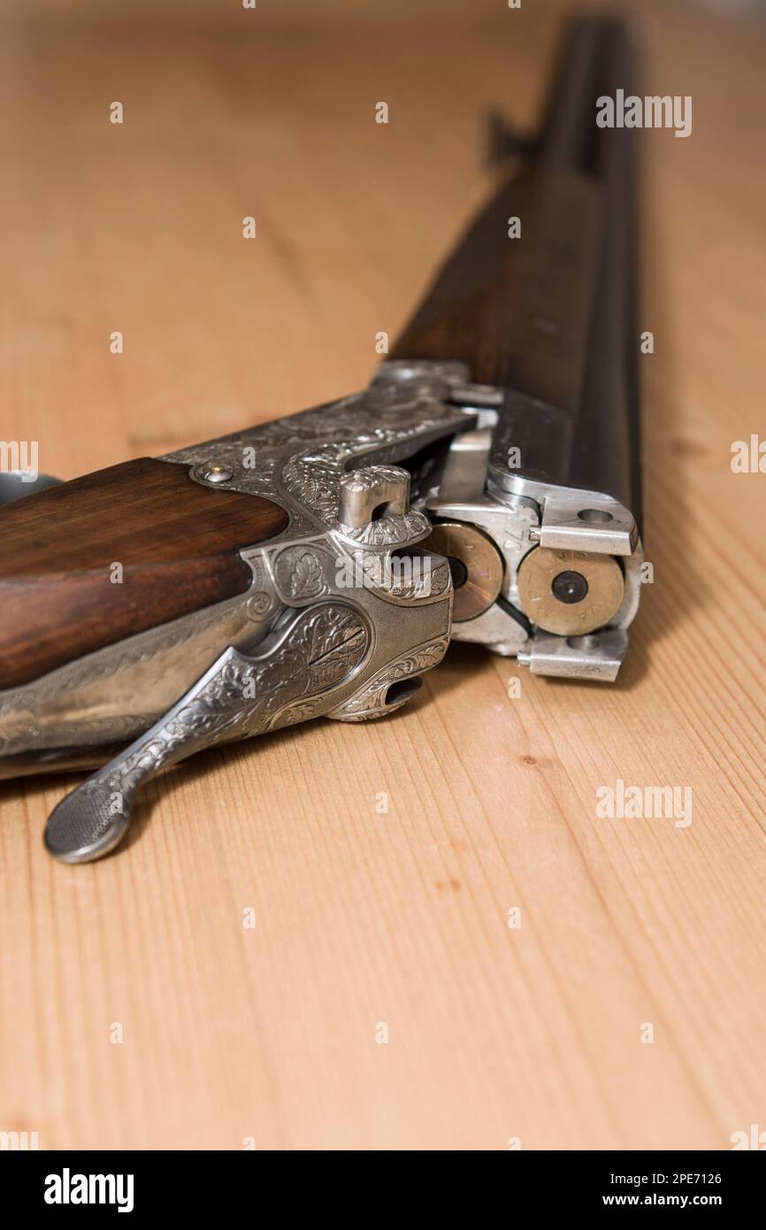 Decorated hunting weapons with ammunition, hunting license and gun ...