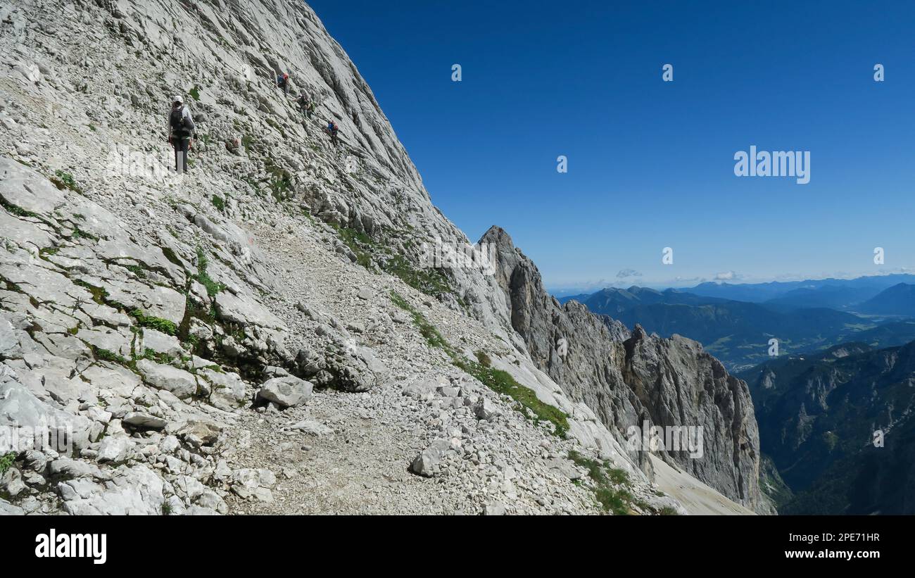 Tourist with equipment on the via ferrata trail in the alps, Dolomites ...
