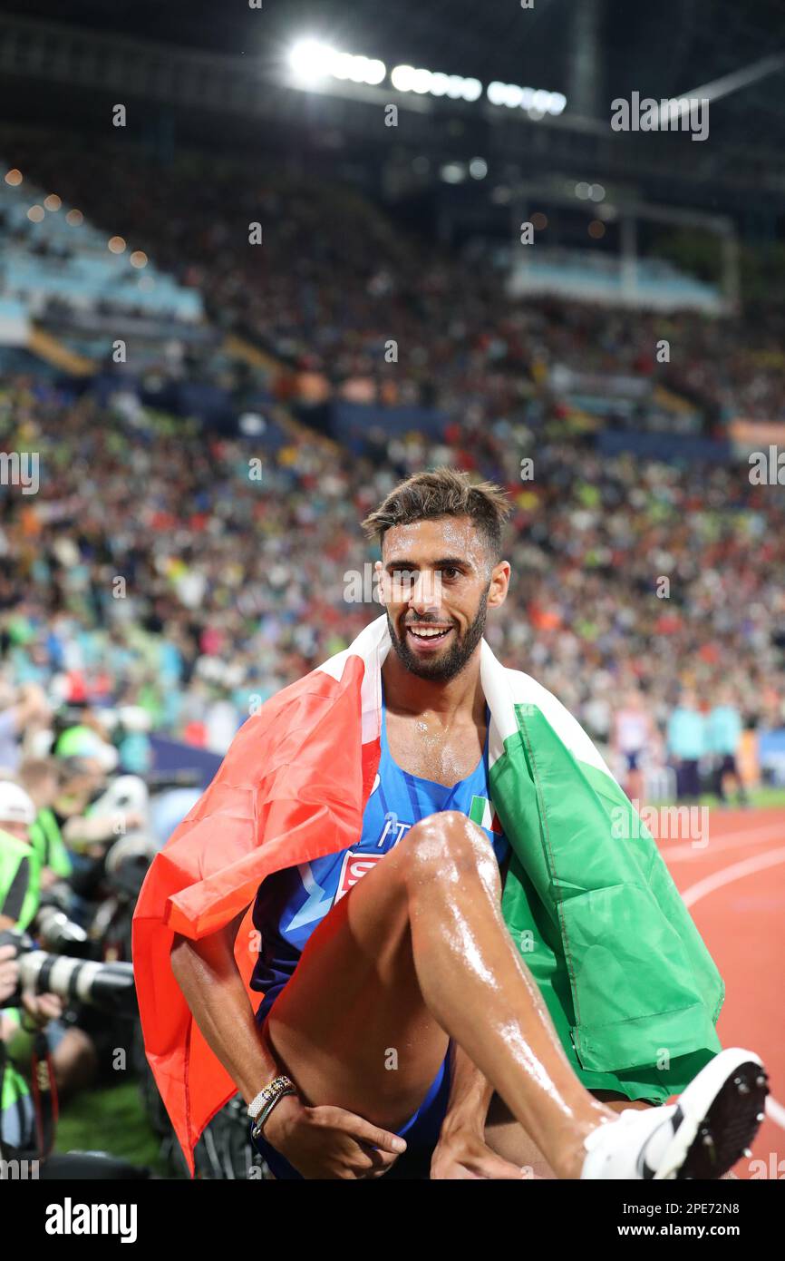 Ahmed ABDELWAHED climbing into the crowd with the Italian Flag after ...