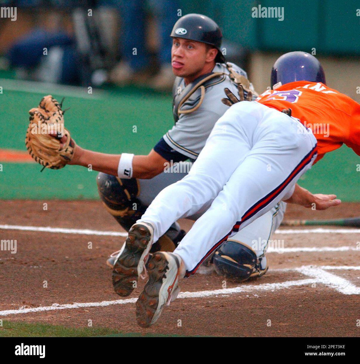 Clemson's Herman Demmink, right, dives past Georgia Tech catcher Andy ...