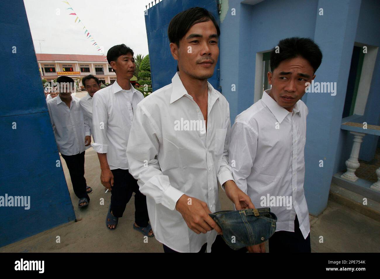 Anthony Nguyen, holding ball cap, of Washington, D. C., smiles as he ...