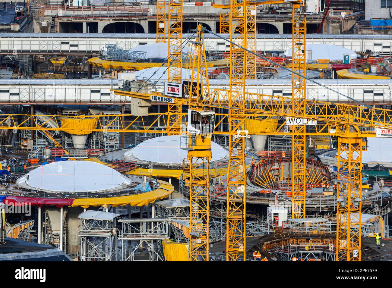 Large construction site for the new underground station with cranes. In ...