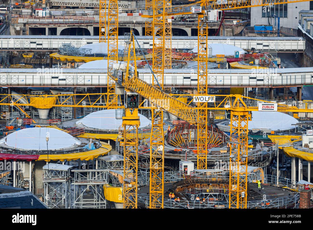 Large construction site for the new underground station with cranes. In ...