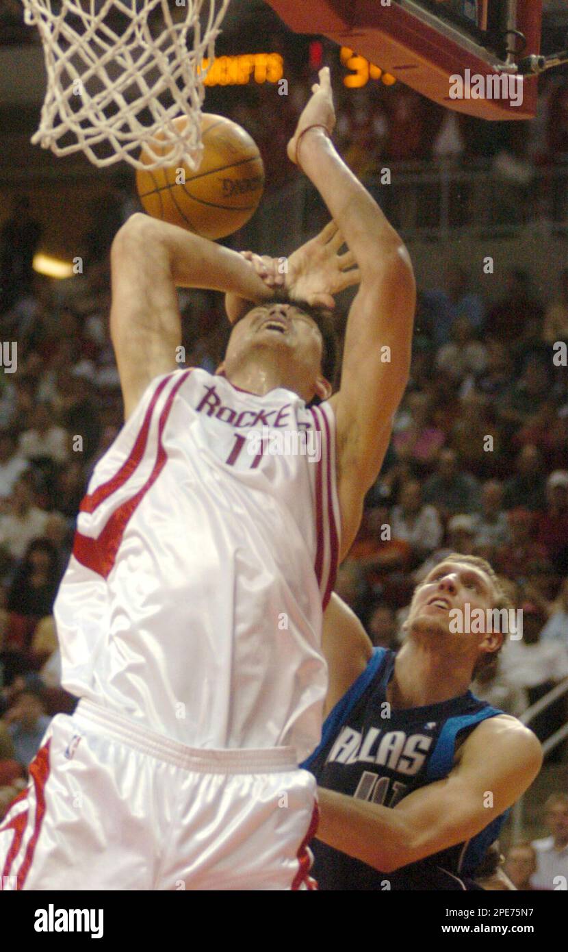 Dallas Mavericks' Dirk Nowitzki (41) of Germany fouls Houston Rockets ...