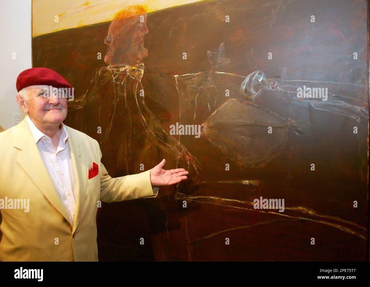 Australia's best known painter John Olsen stands next to his painting ...