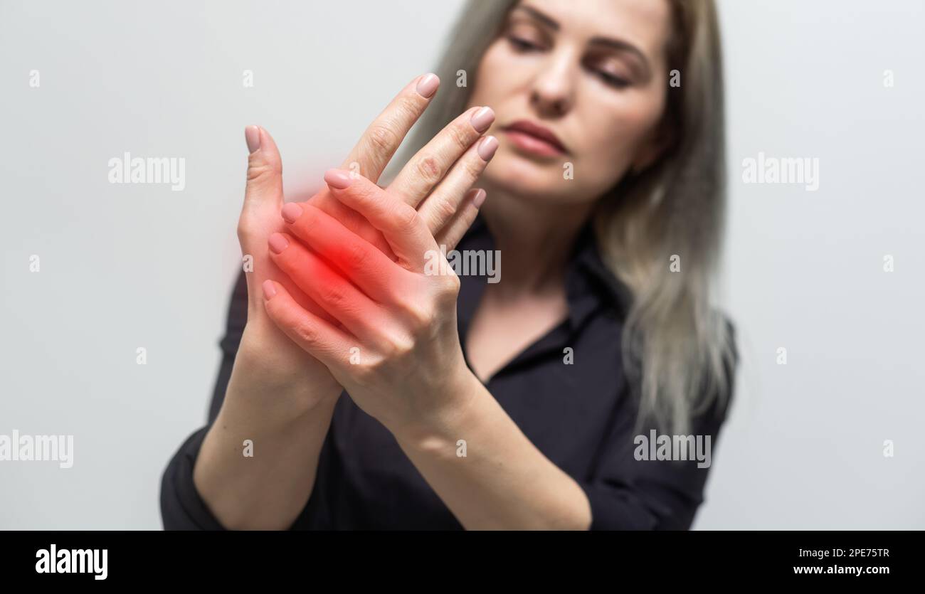 Wrist pain. Painful hand with red spot closeup. Sprain, fracture ...